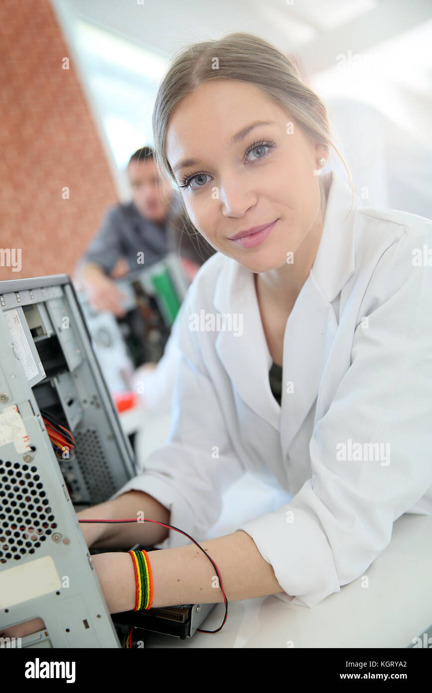 Student girl in technology fixing computer hard drive Stock Photo - Alamy