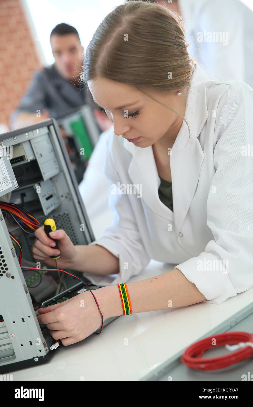 Student girl in technology fixing computer hard drive Stock Photo - Alamy