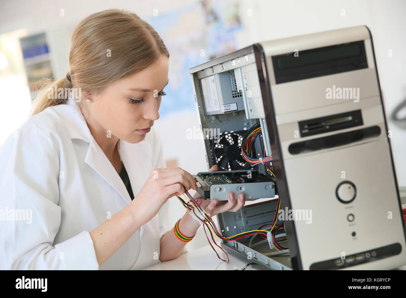 Student girl in technology fixug computer hard drive Stock Photo - Alamy