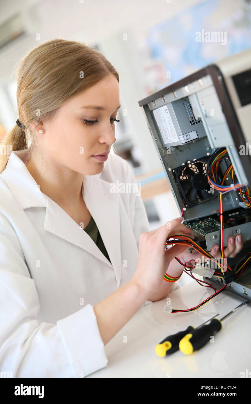 Student girl in technology fixug computer hard drive Stock Photo - Alamy