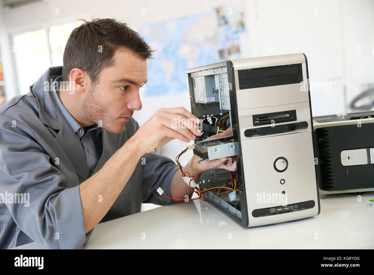 Technician fixing computer hardware Stock Photo - Alamy