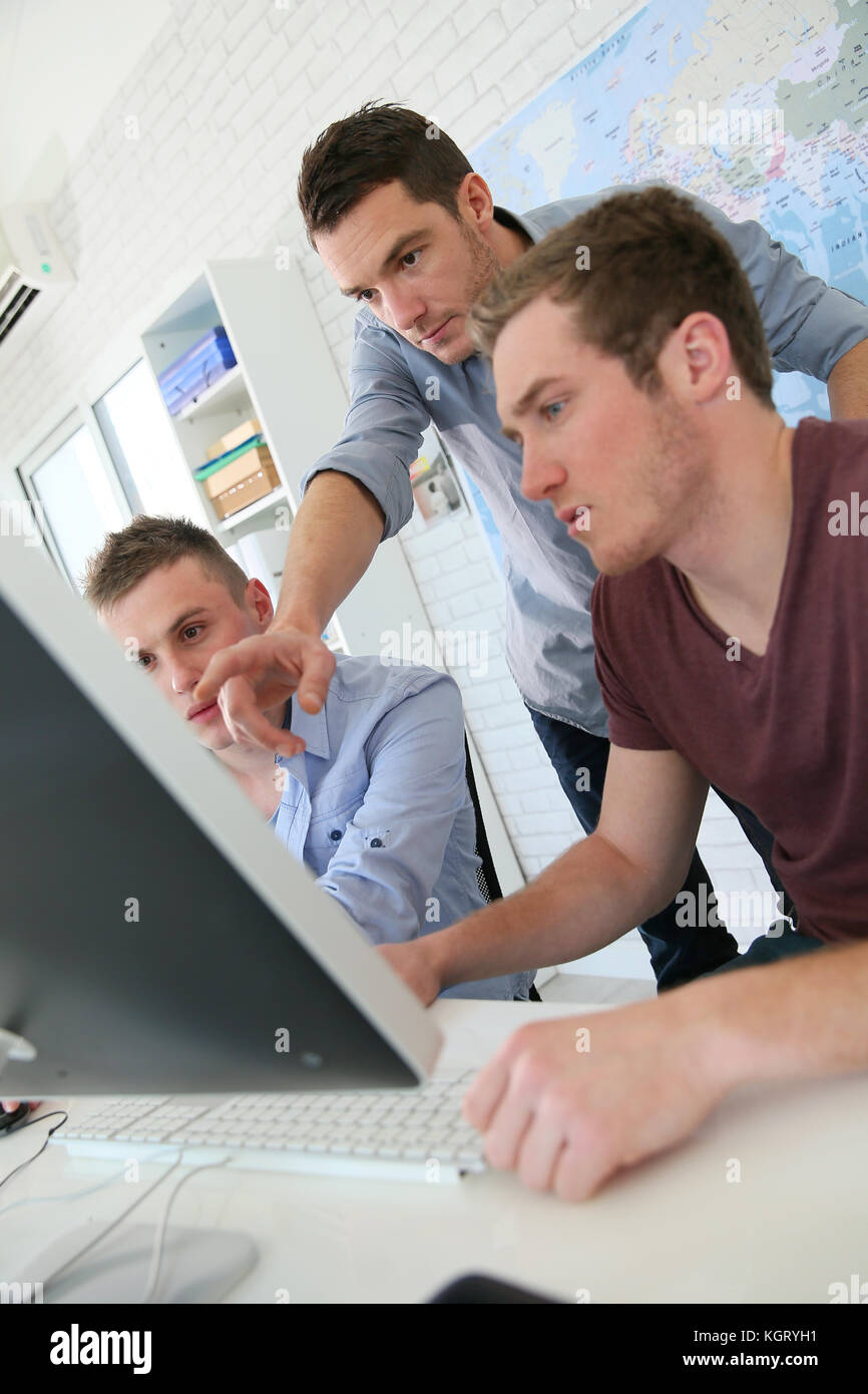 Students in digital design training course with instructor Stock Photo ...