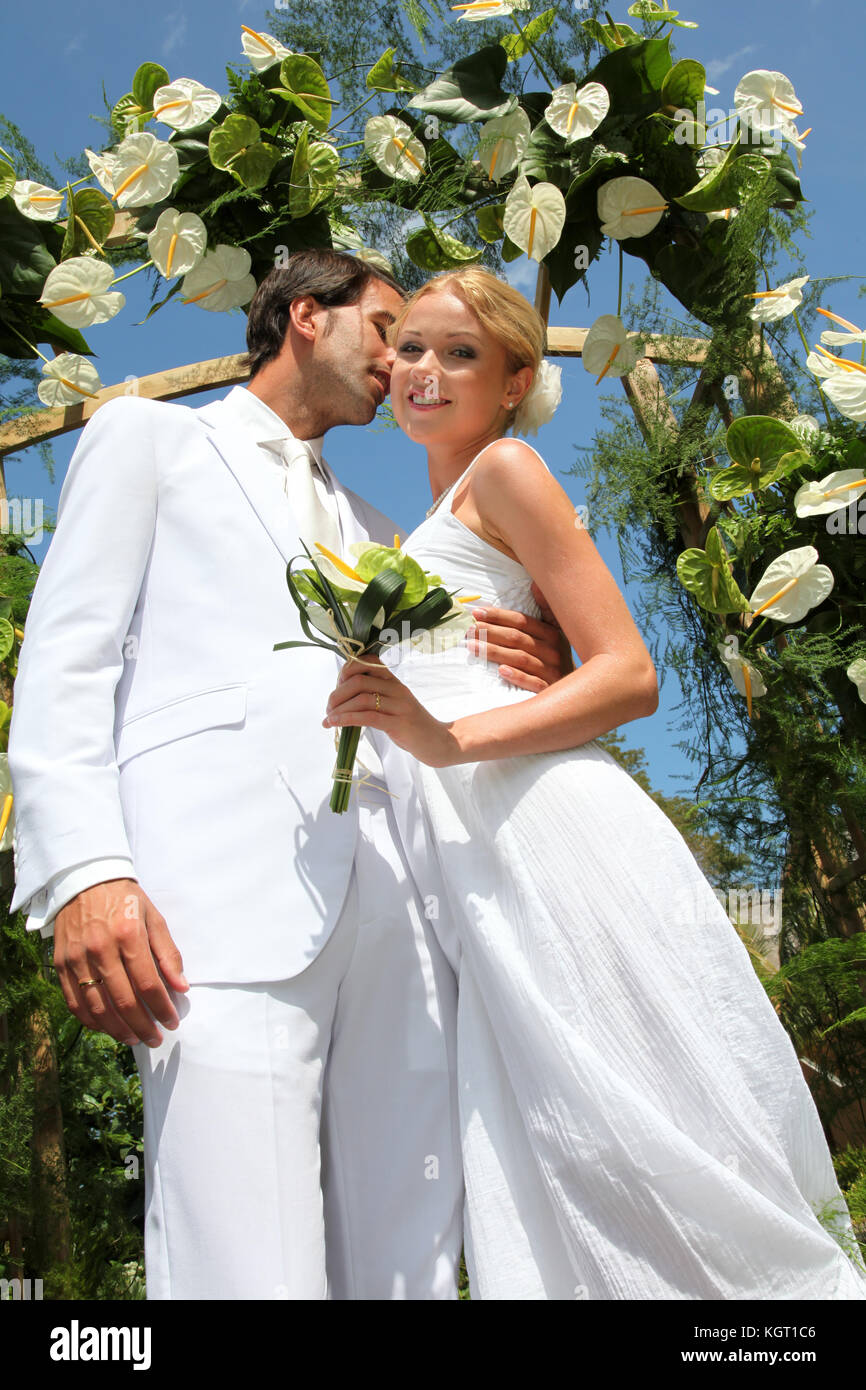 Groom kissing bride on wedding day Stock Photo - Alamy