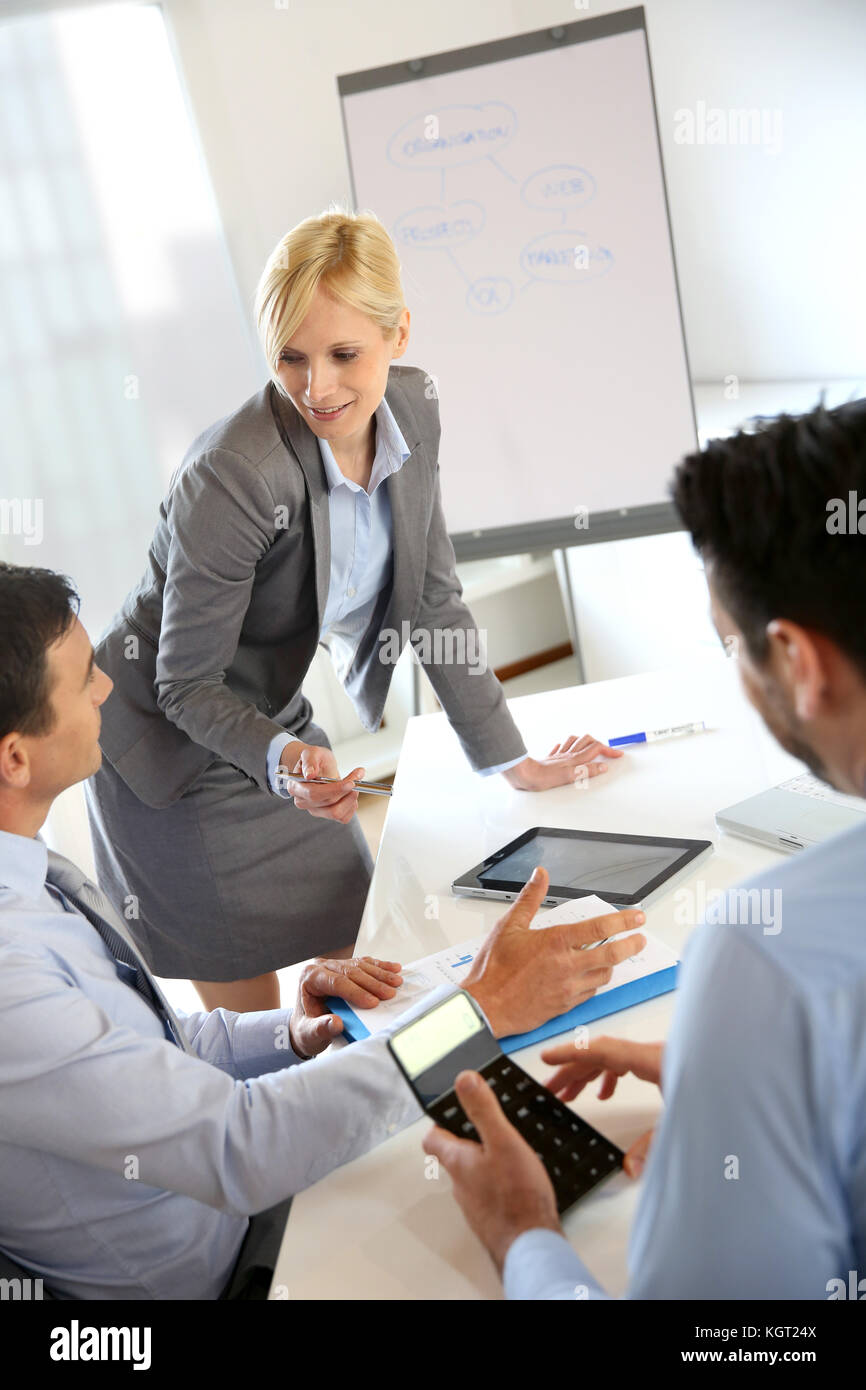 Executive woman making business presentation Stock Photo - Alamy