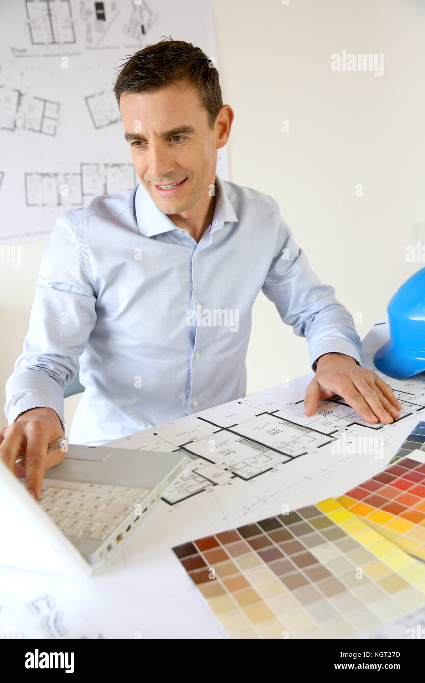 Architect working on laptop computer Stock Photo - Alamy