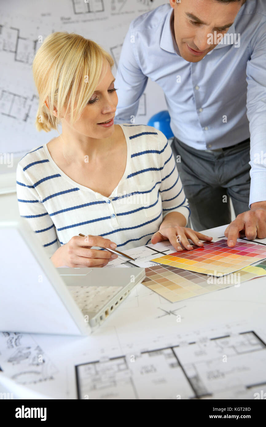 Team of architects working together on project Stock Photo - Alamy
