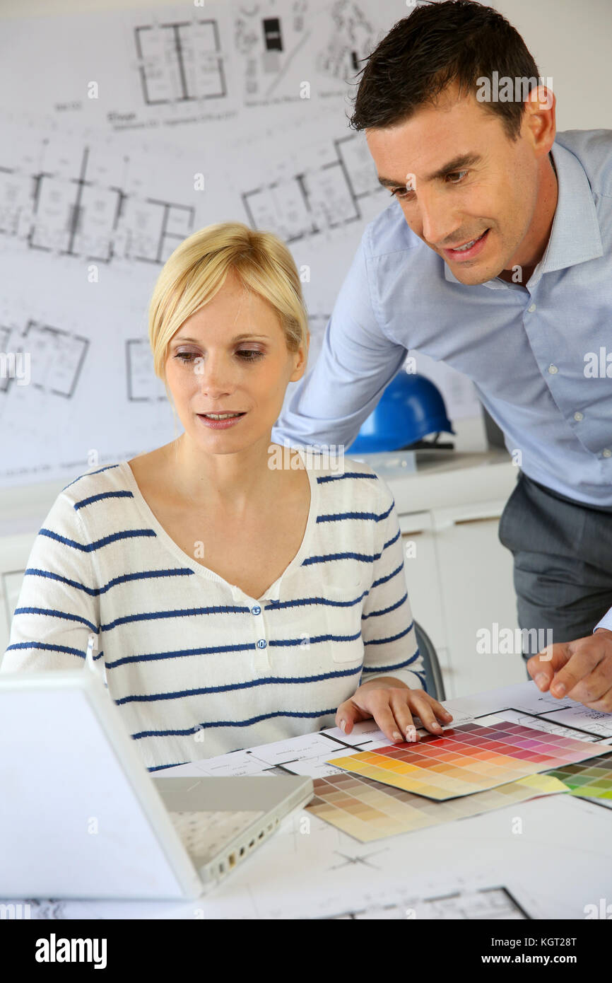 Team of architects working together on project Stock Photo - Alamy