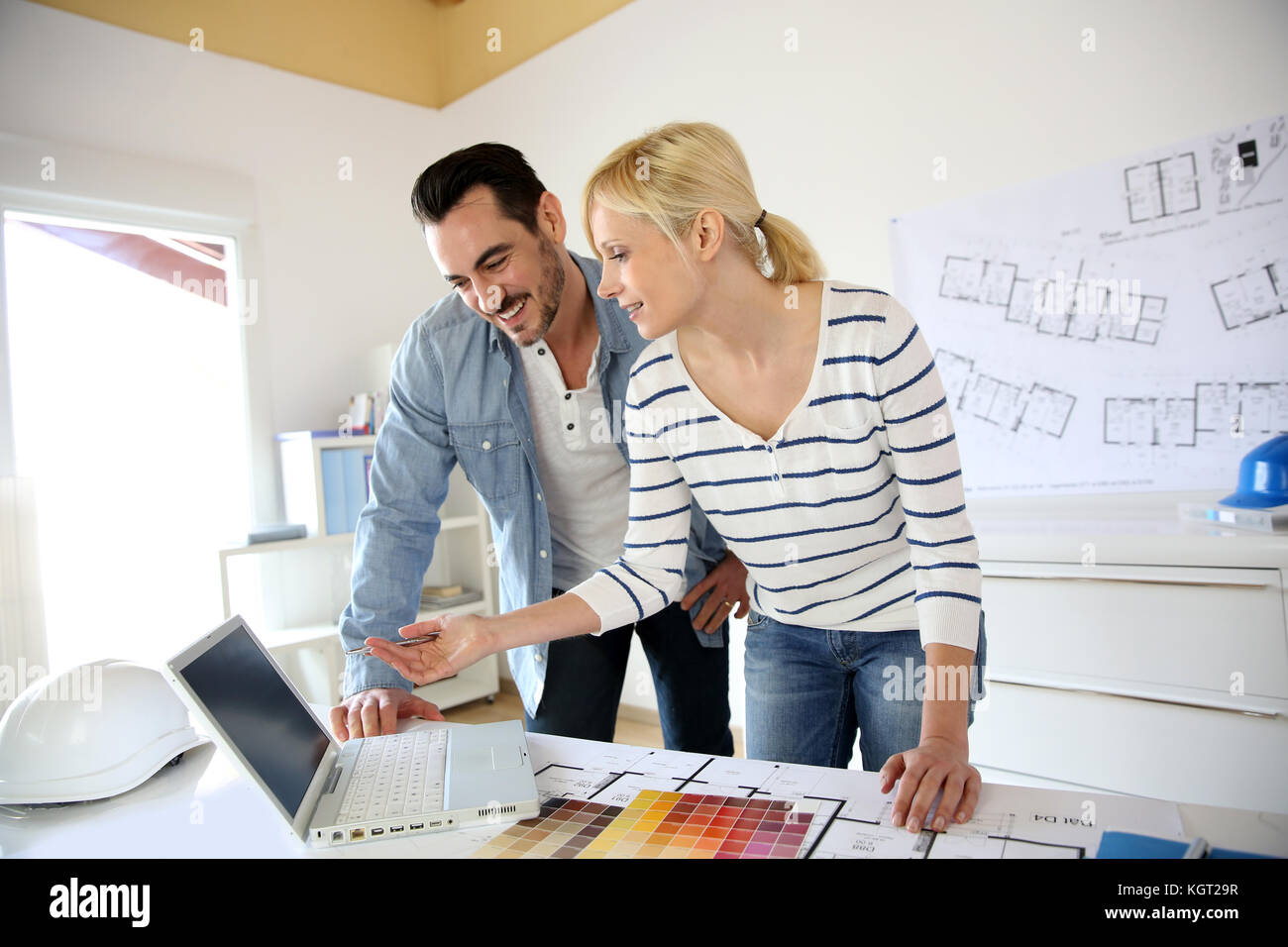 Architects working together in office Stock Photo - Alamy