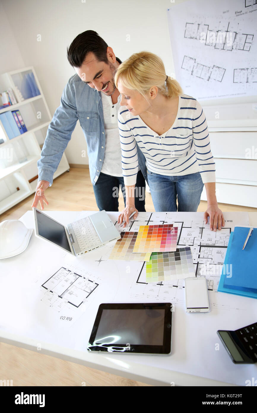 Architects working together in office Stock Photo - Alamy