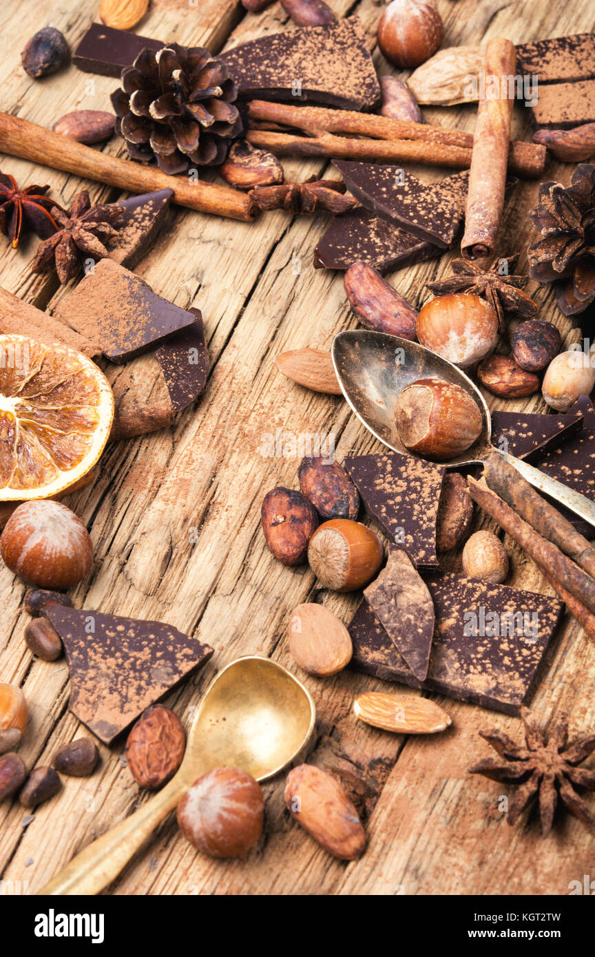 Heap of broken chocolate pieces and nut.Chocolate background Stock ...