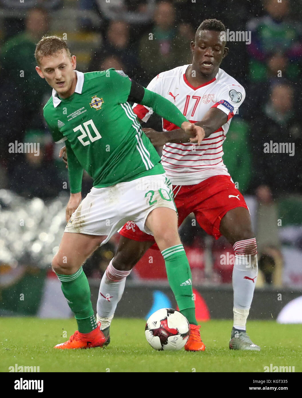 Northern Ireland's George Saville (left) and Switzerland's Denis ...