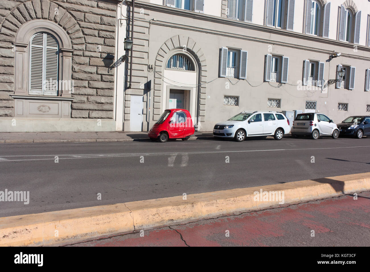 FLORENCE, ITALY - FEBRUARY 07, 2017: small, single, one person, red car ...