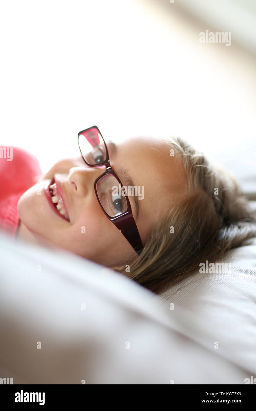 Portrait of cute little girl wearing eyeglasses Stock Photo - Alamy