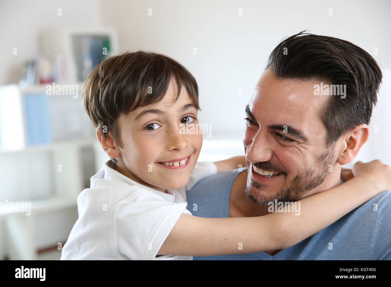 Portrait of father and son relaxing at home Stock Photo - Alamy