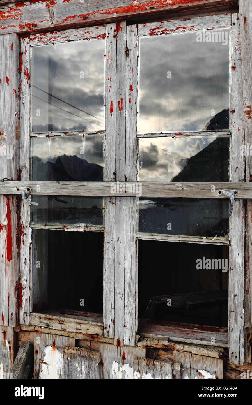 Glass lacking-broken window of snow covered-fully ruined-abandoned ...