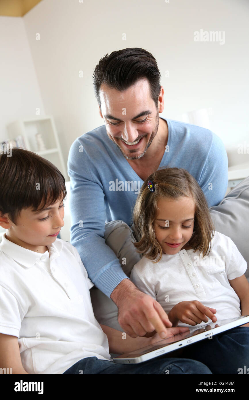 Father son using touchscreen tablet hi-res stock photography and images ...