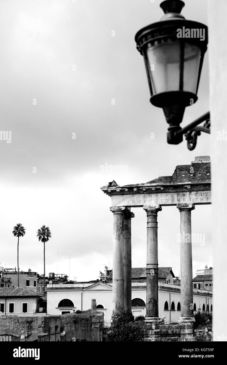 Rome scene at the Roman Forum with street lamp and Temple of Saturn ...