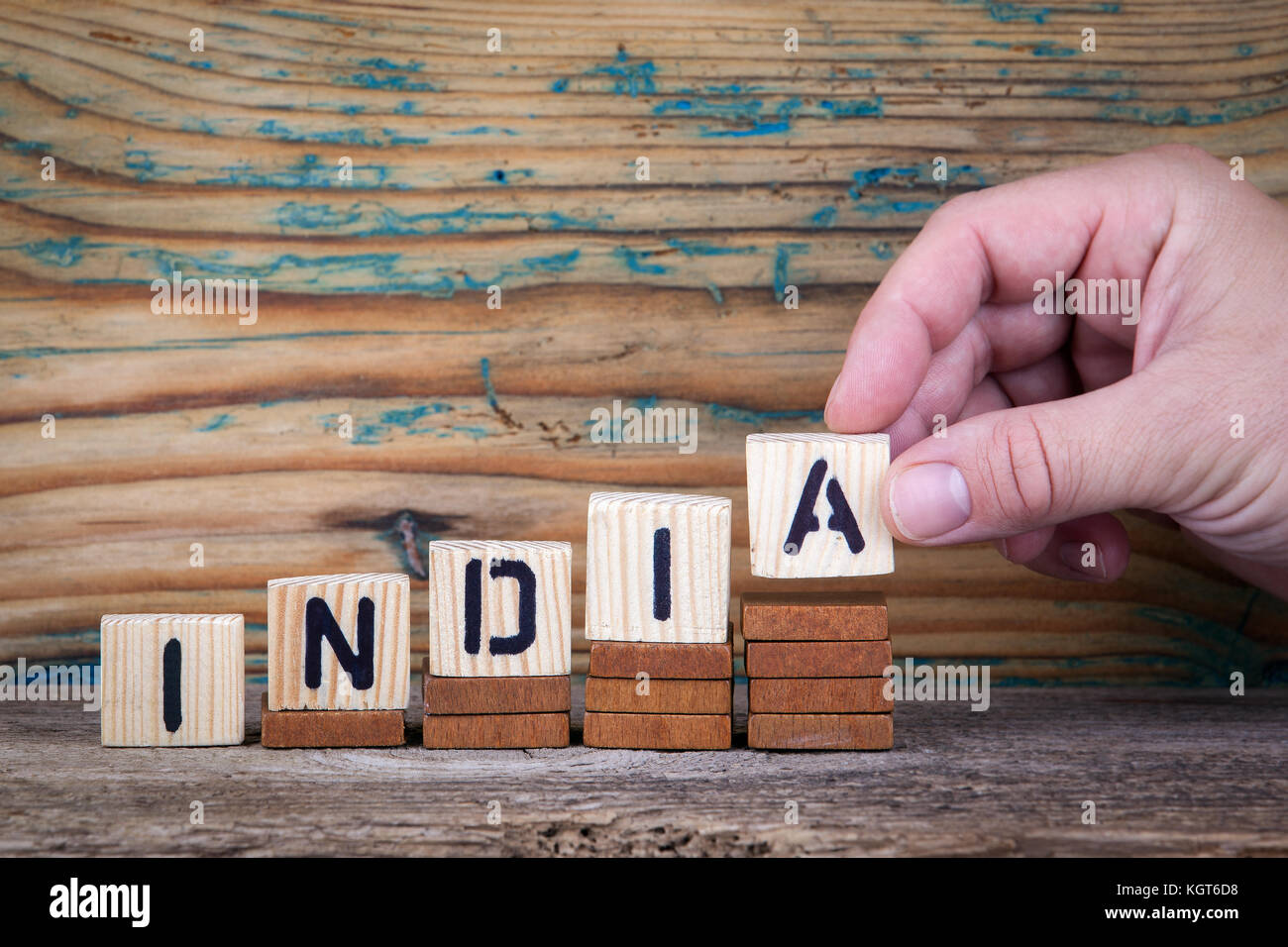 India. Wooden letters on the office desk, informative and communication ...