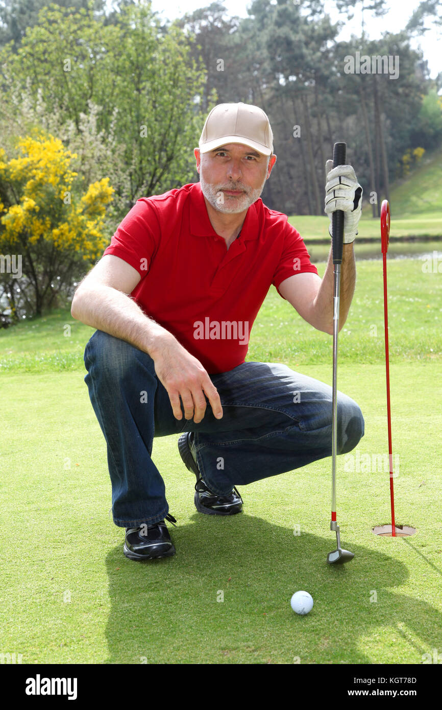 Senior man on golf course Stock Photo - Alamy