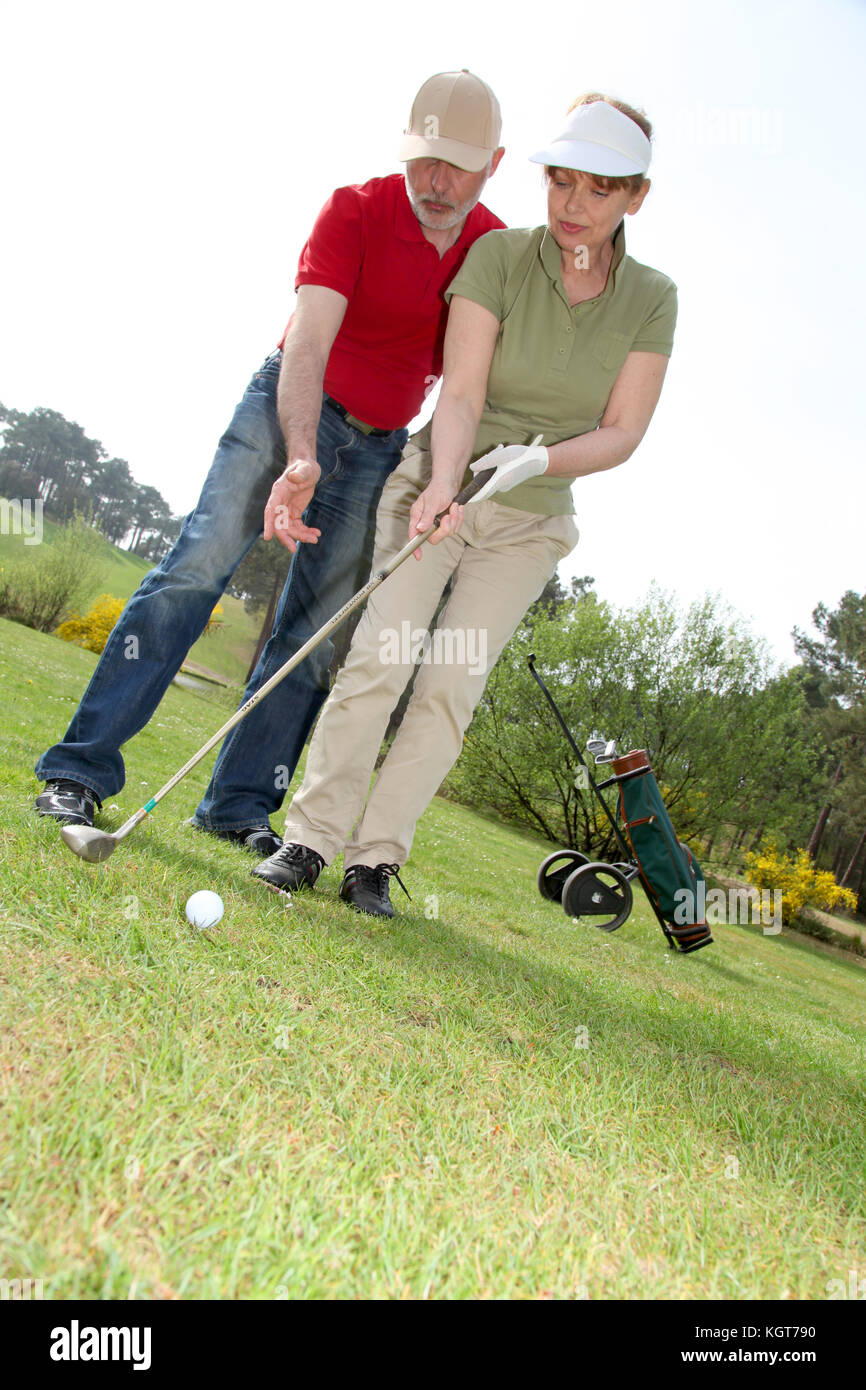 Senior people on golf course Stock Photo - Alamy