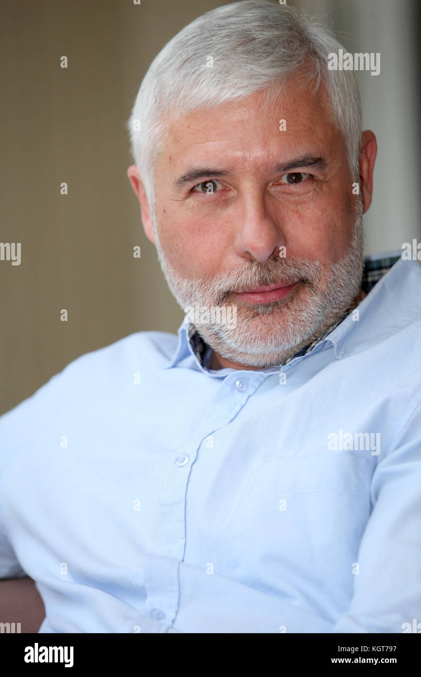 Portrait of smiling senior man Stock Photo - Alamy