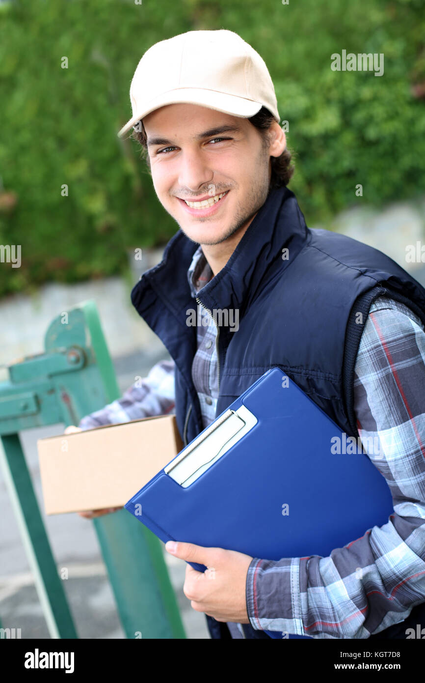 Portrait of smiling delivery man Stock Photo - Alamy