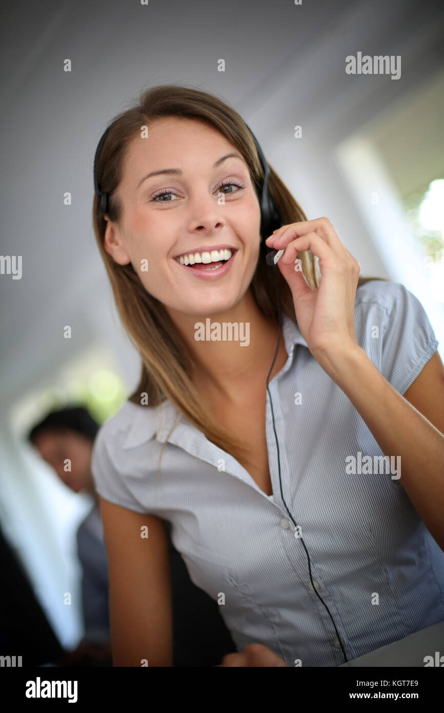 Portrait of beautiful customer service representative Stock Photo - Alamy