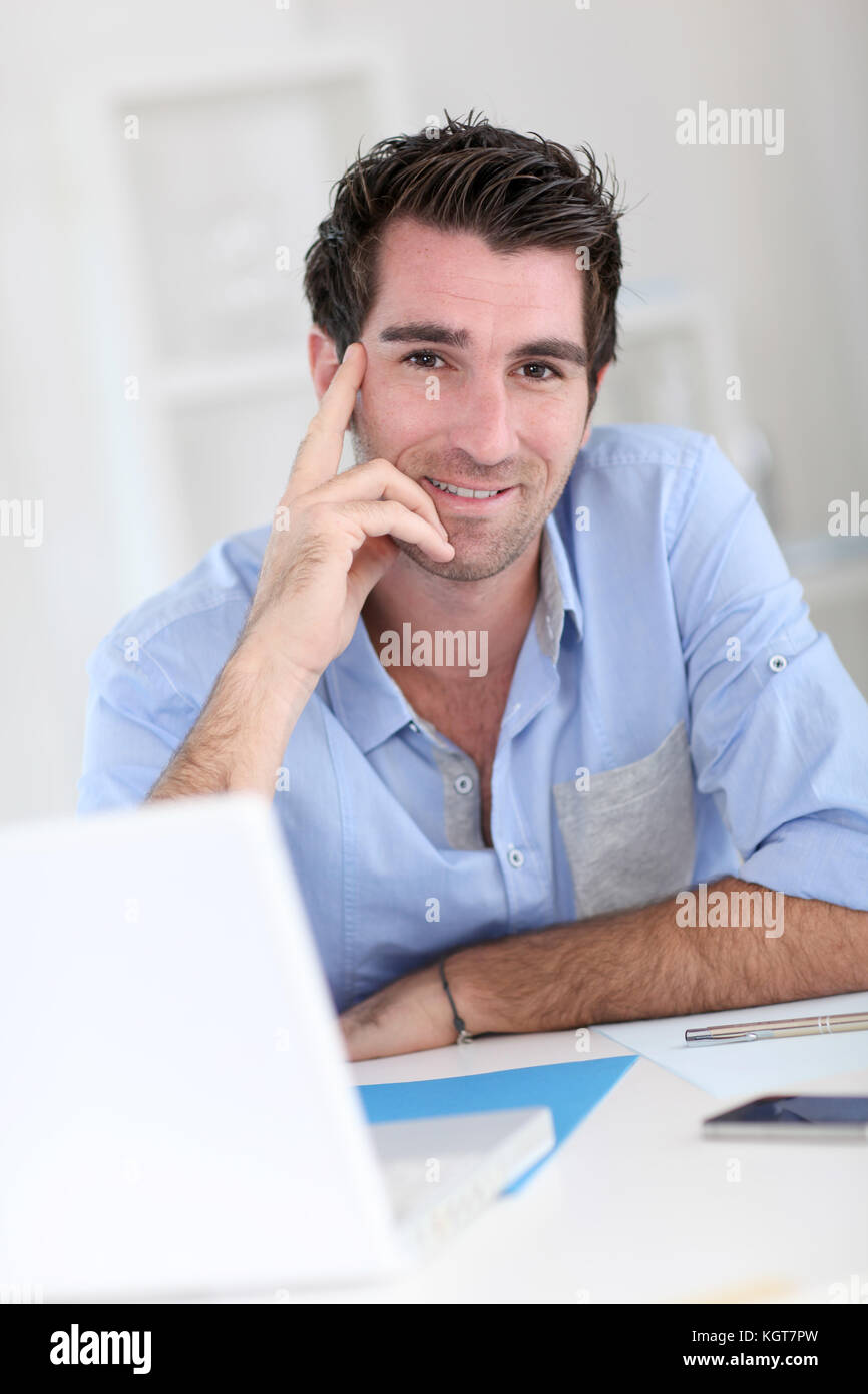 Smiling office worker at work Stock Photo - Alamy Smiling office worker at work Stock Photo - Alamy