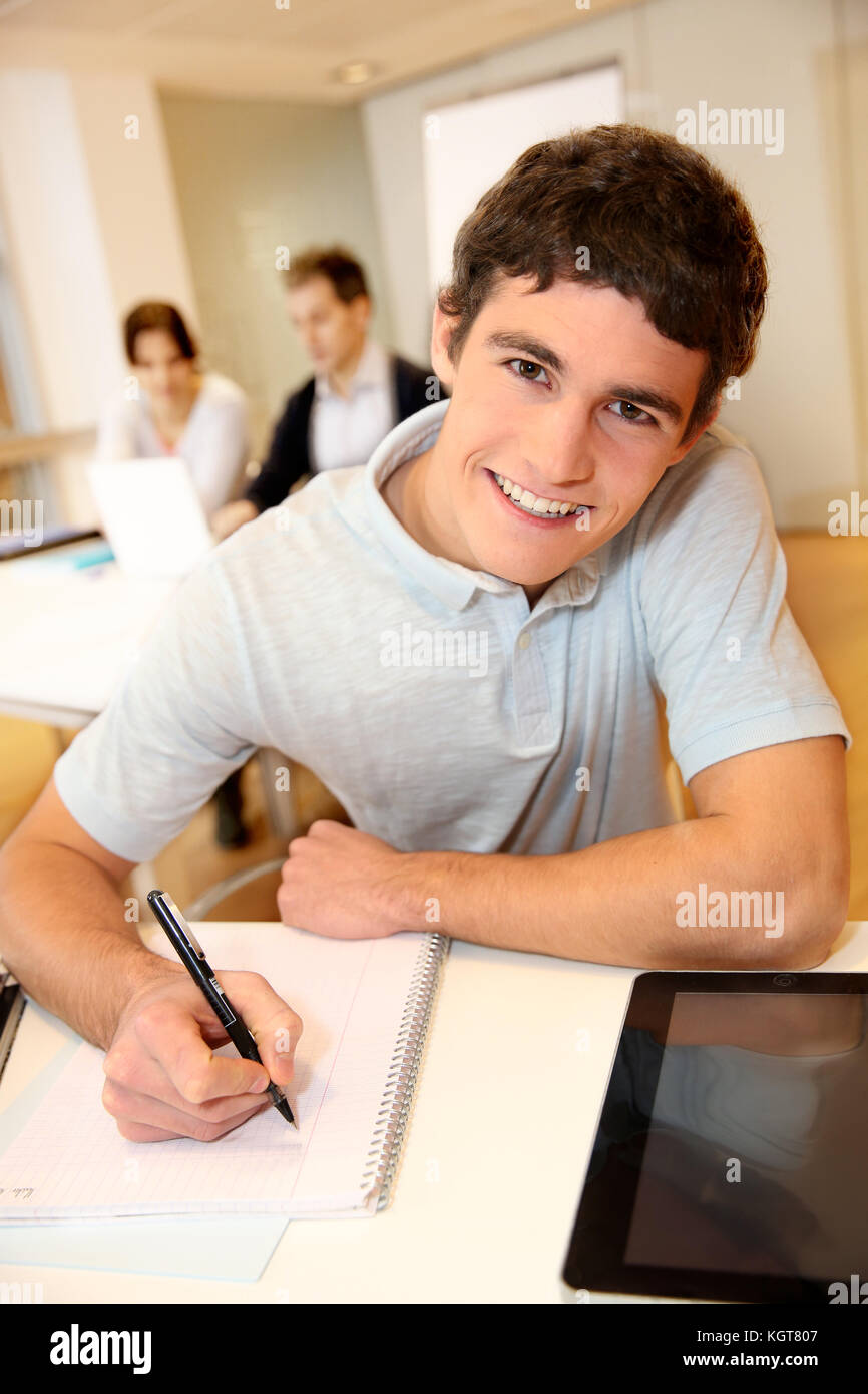 Teen boy writing classroom hi-res stock photography and images - Alamy