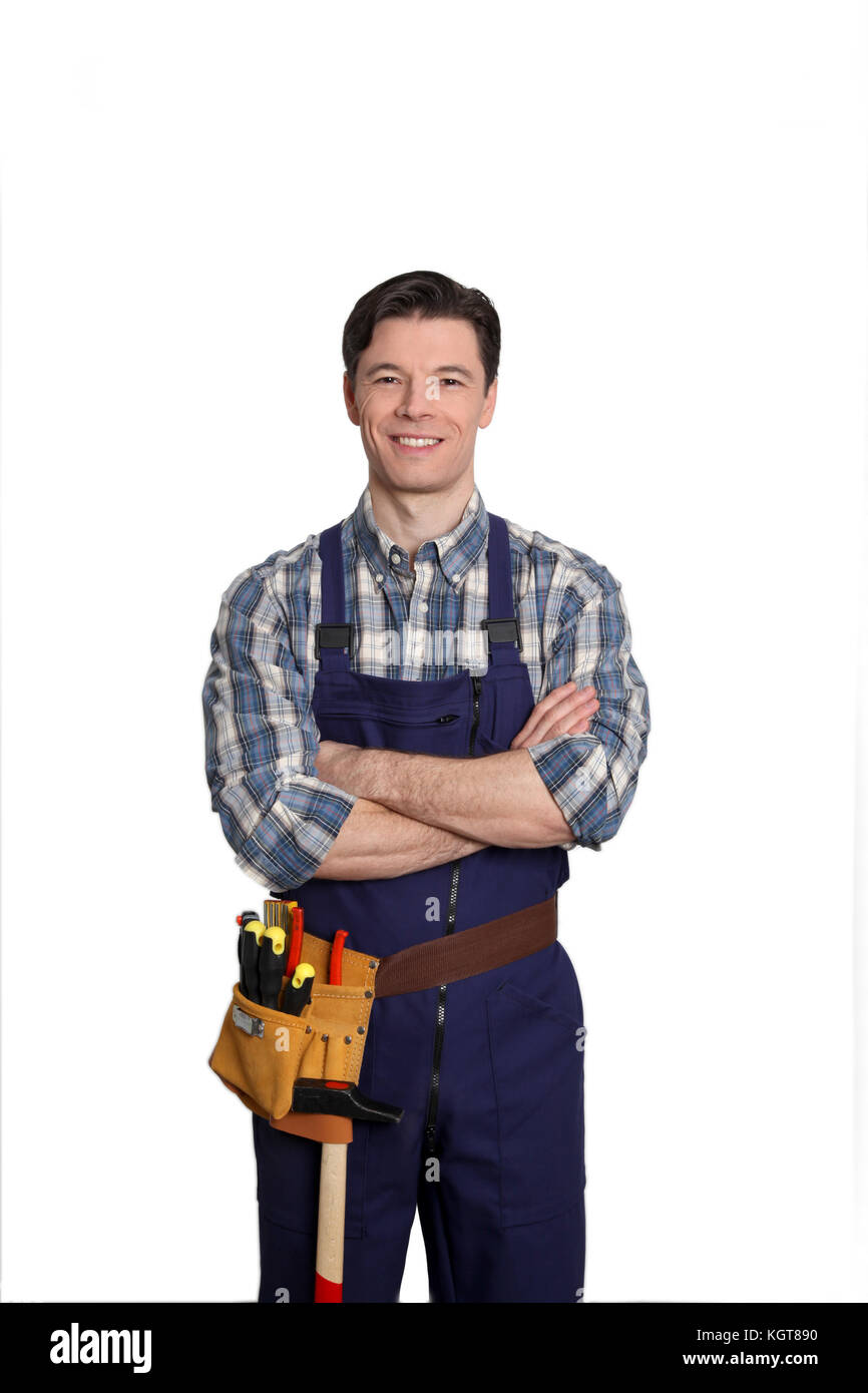 Carpenter standing on white background with arms crossed Stock Photo ...