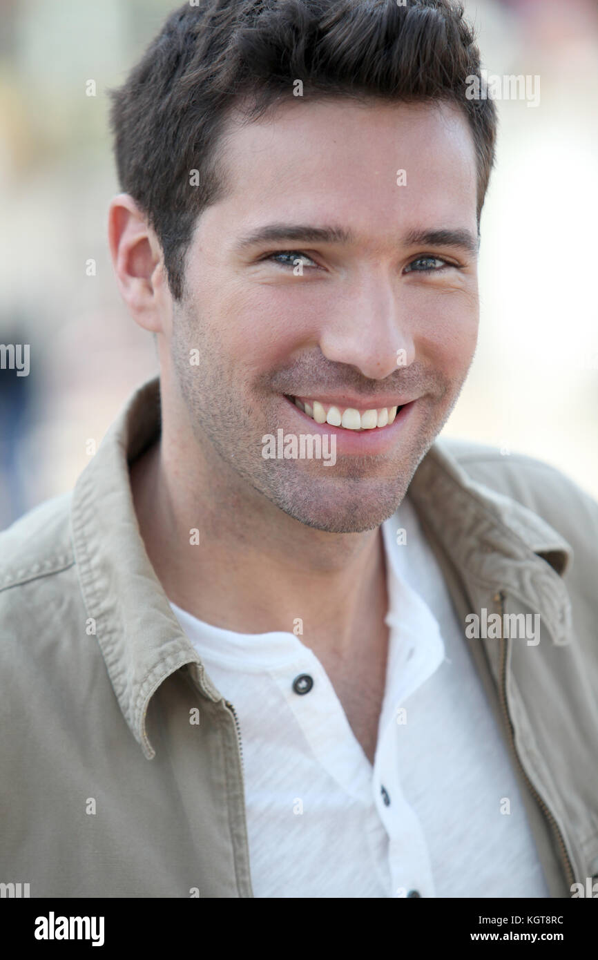 Portrait of handsome smiling man Stock Photo - Alamy