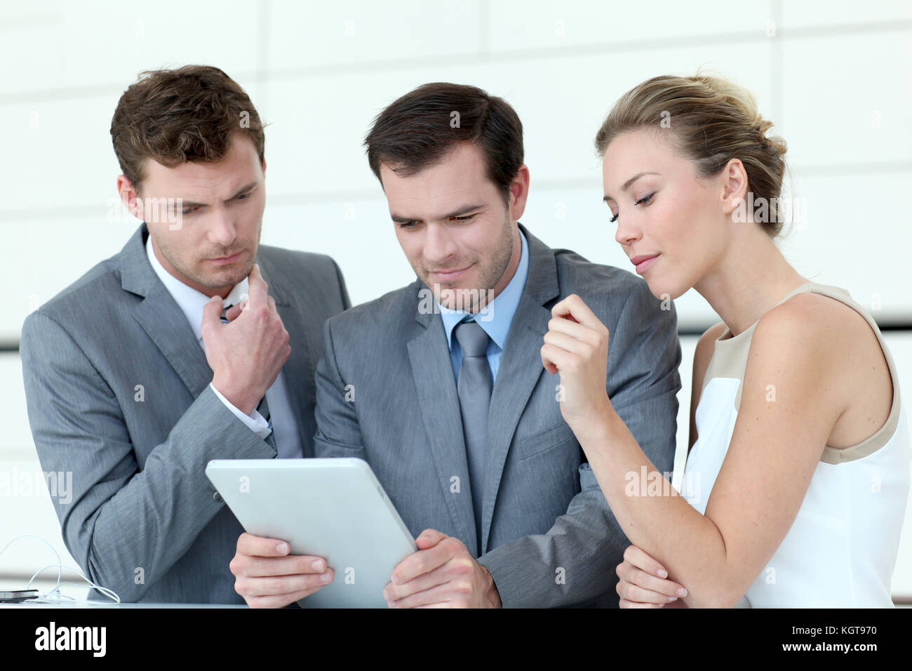 Business team working with electronic tablet Stock Photo - Alamy