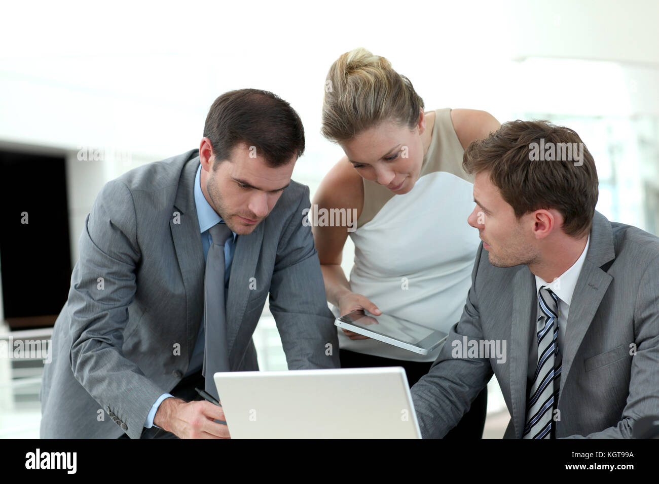 Group of business people meeting around table Stock Photo - Alamy