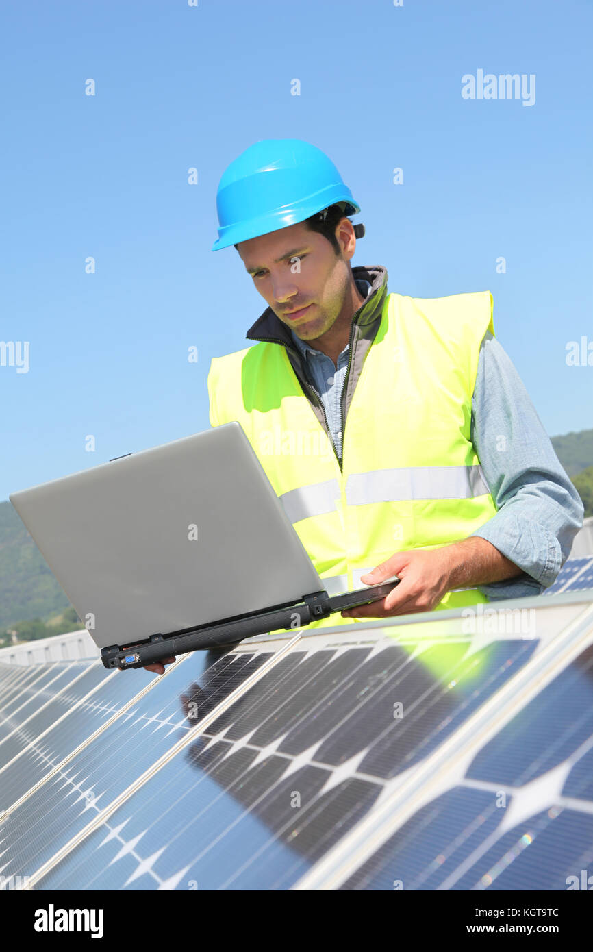 Engineer checking photovoltaic installation Stock Photo - Alamy