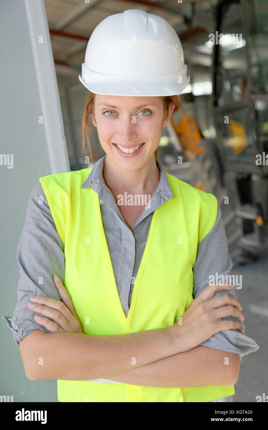 Woman engineer standing on building site Stock Photo - Alamy
