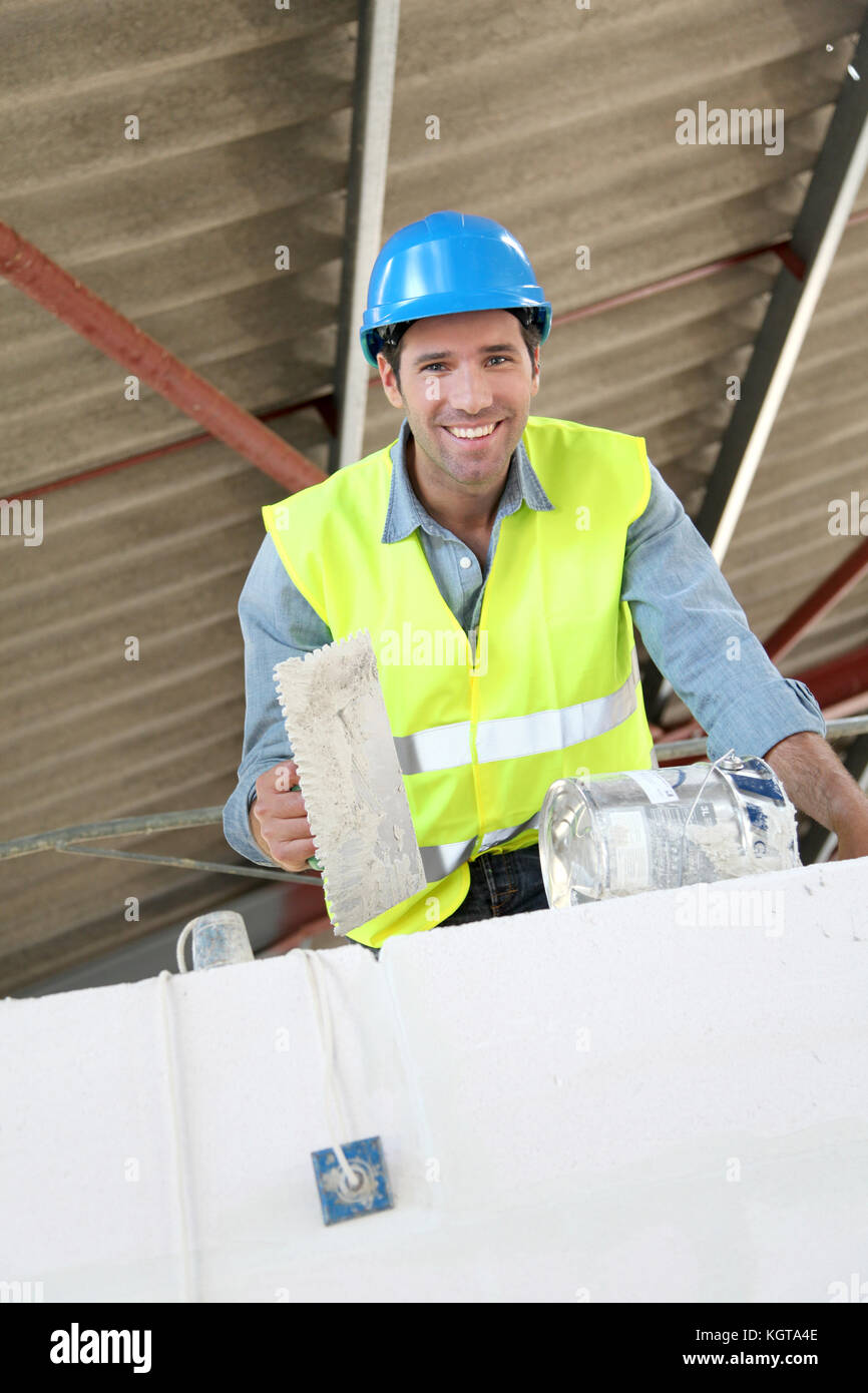 Bricklayer at work on construction site Stock Photo - Alamy