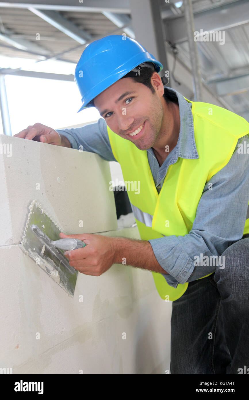 Bricklayer at work on construction site Stock Photo - Alamy