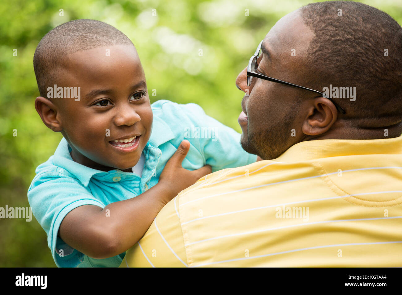 Father hugging his his son Stock Photo - Alamy