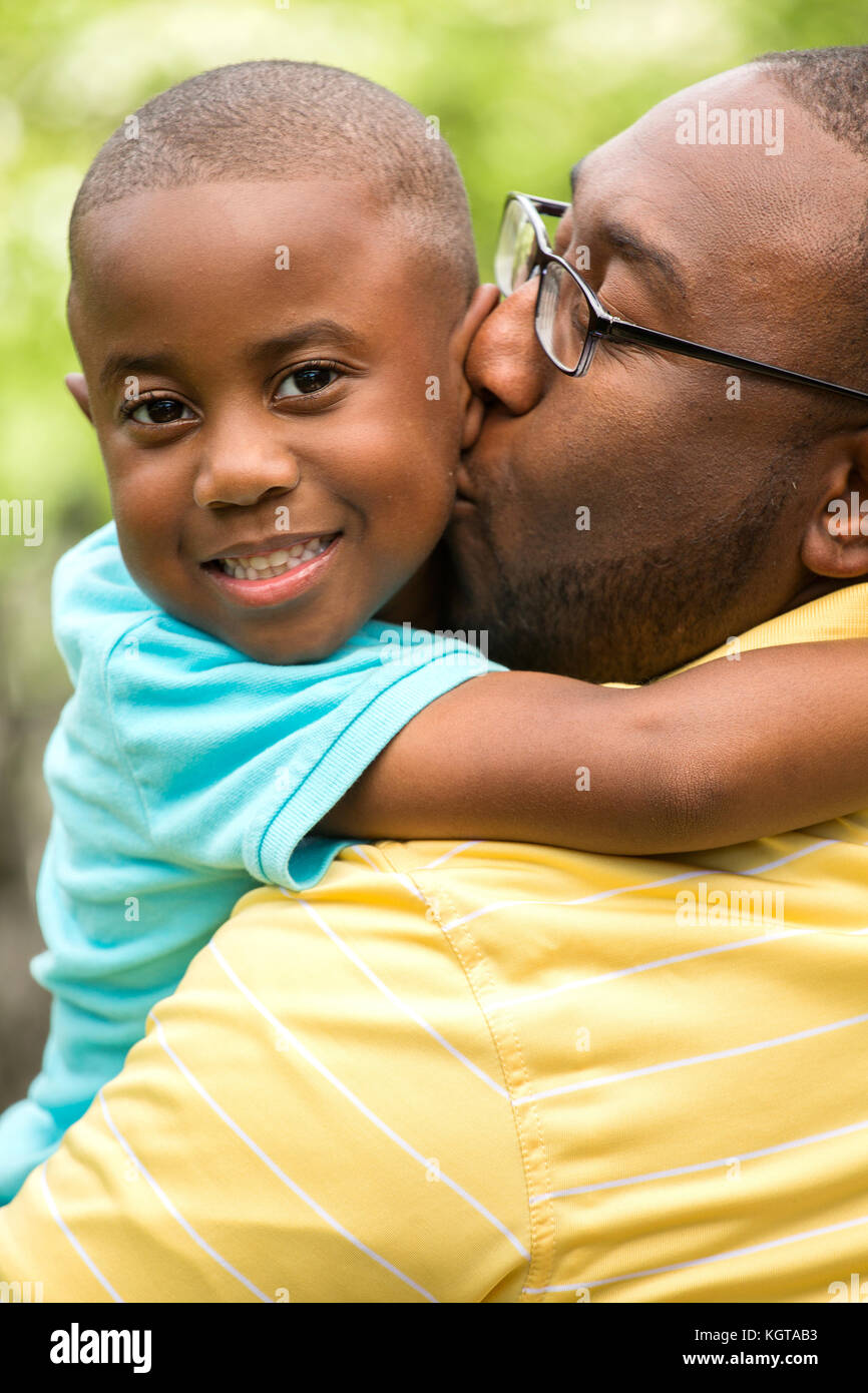 Father hugging his his son Stock Photo - Alamy