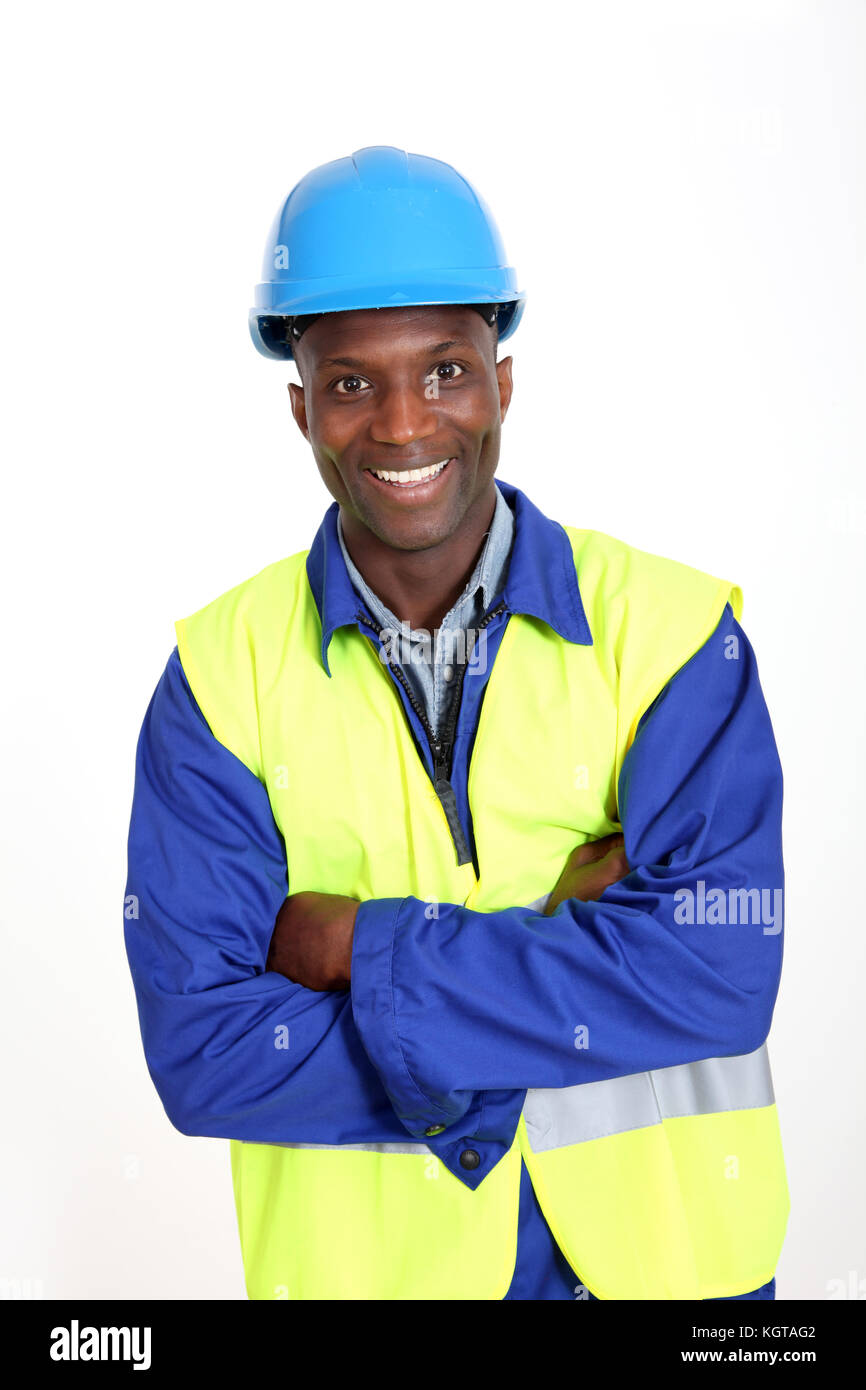 Construction worker standing on white background Stock Photo - Alamy