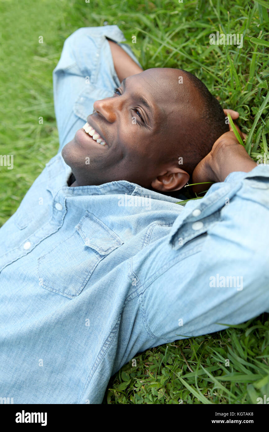 Man taking a nap in park Stock Photo - Alamy