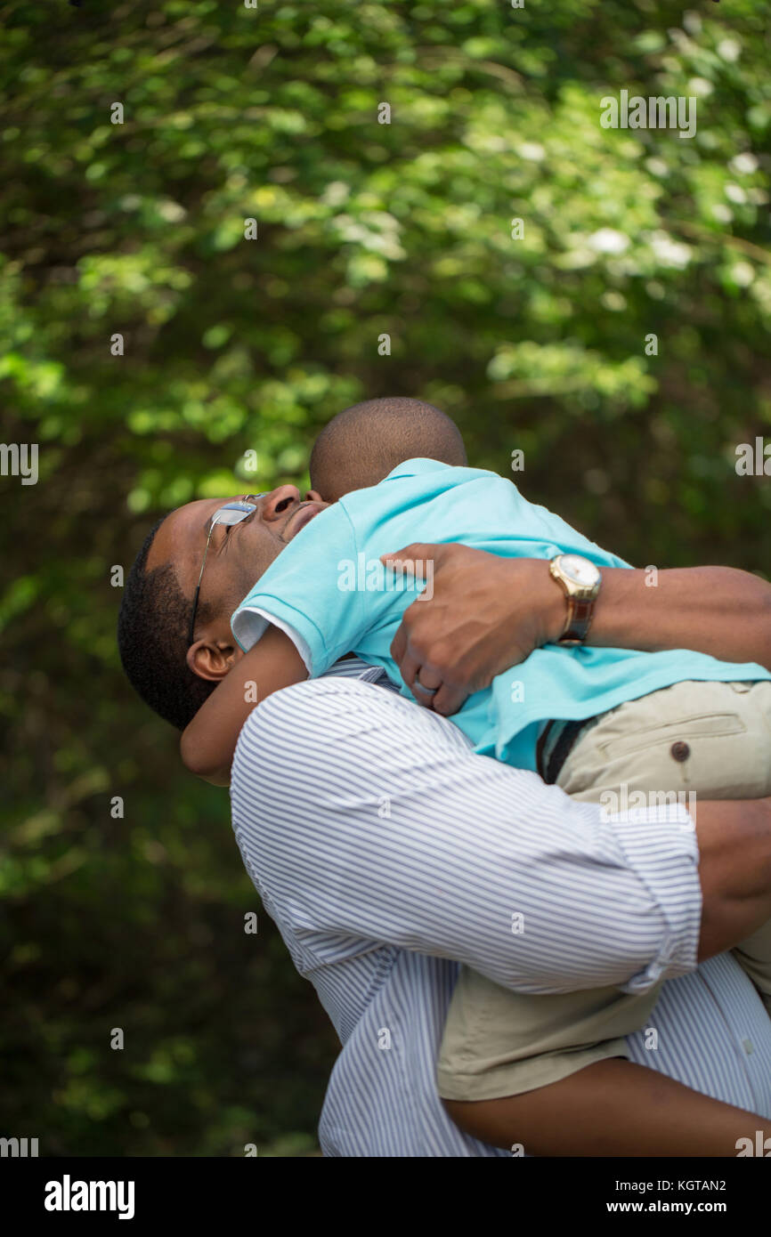 Father hugging his his son Stock Photo - Alamy