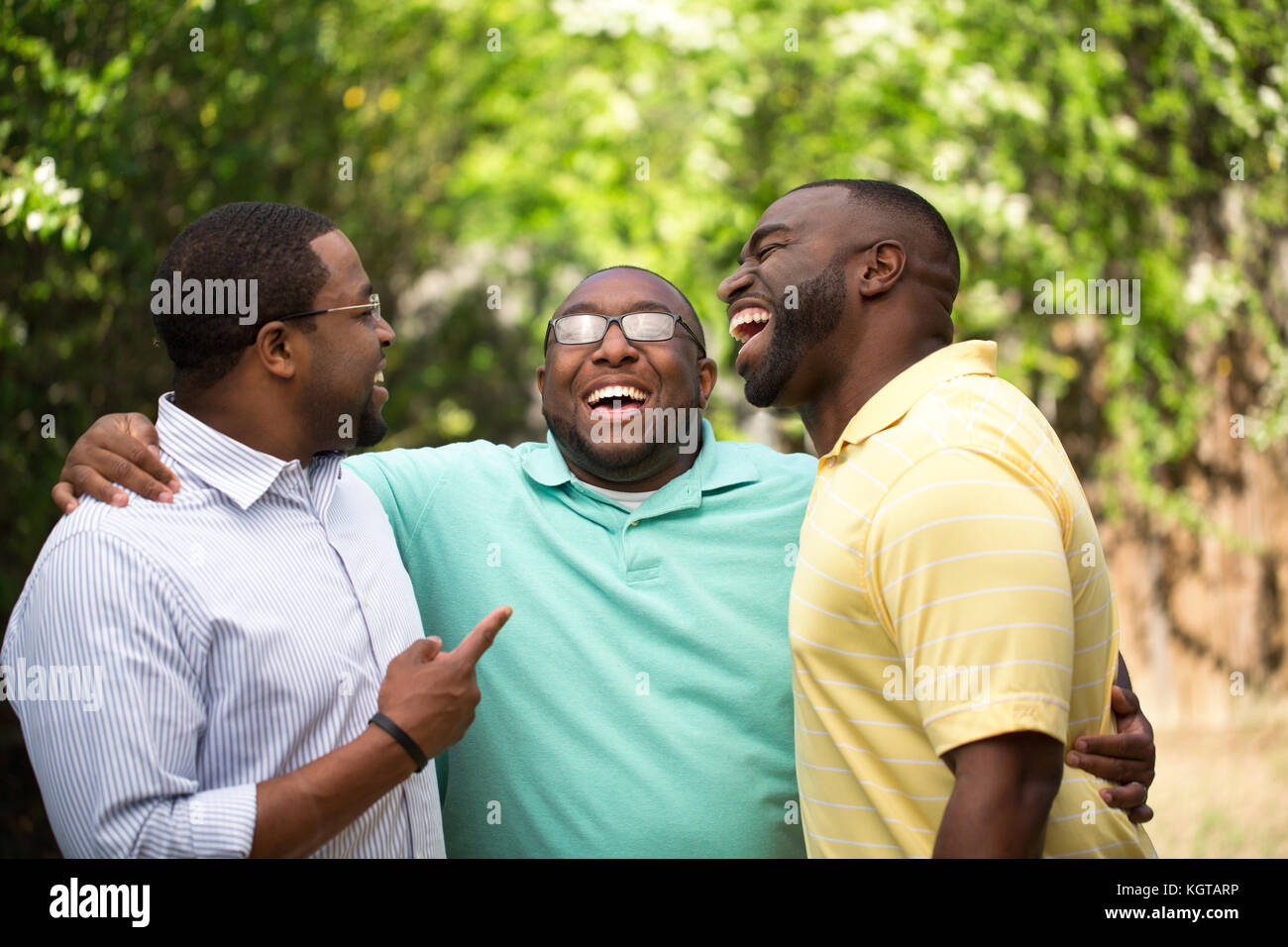Brothers laughing and talking Stock Photo - Alamy