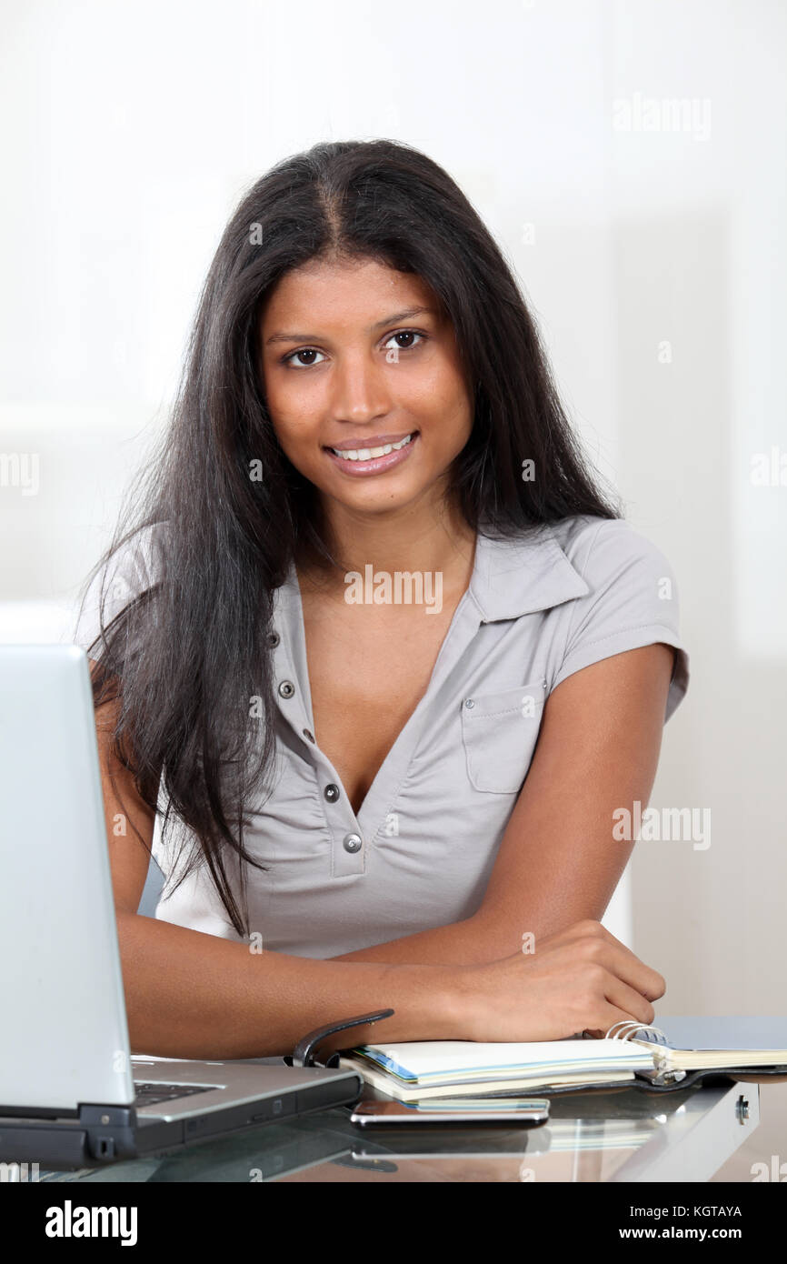 Portrait of beautiful secretary in office Stock Photo - Alamy
