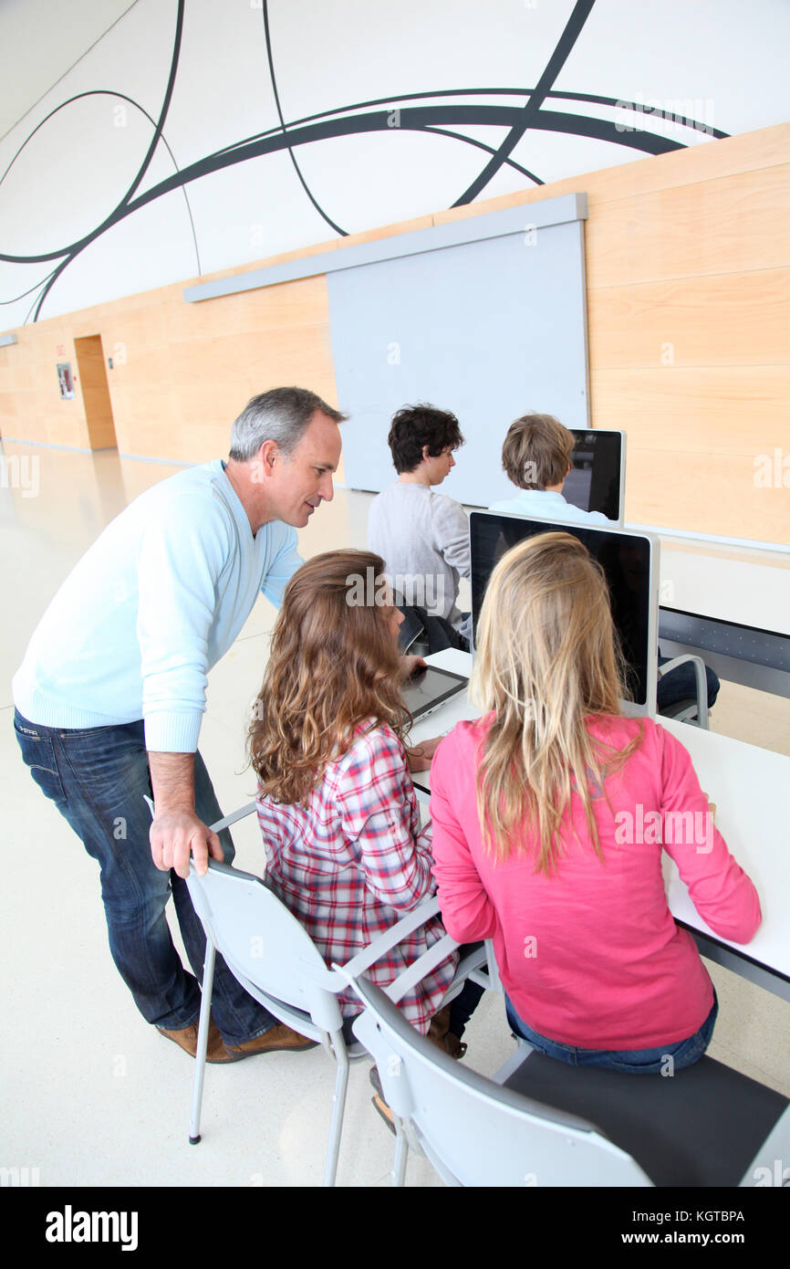 TEacher and students in classroom Stock Photo - Alamy