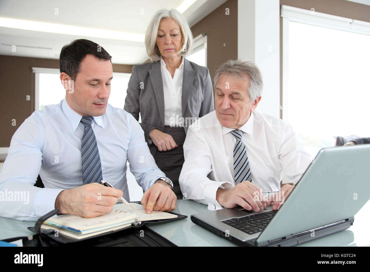 Sales people in work meeting Stock Photo - Alamy