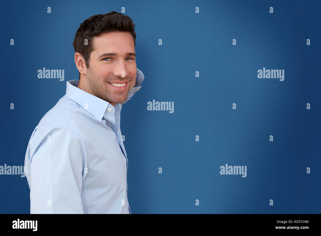 Handsome man on blue background Stock Photo - Alamy