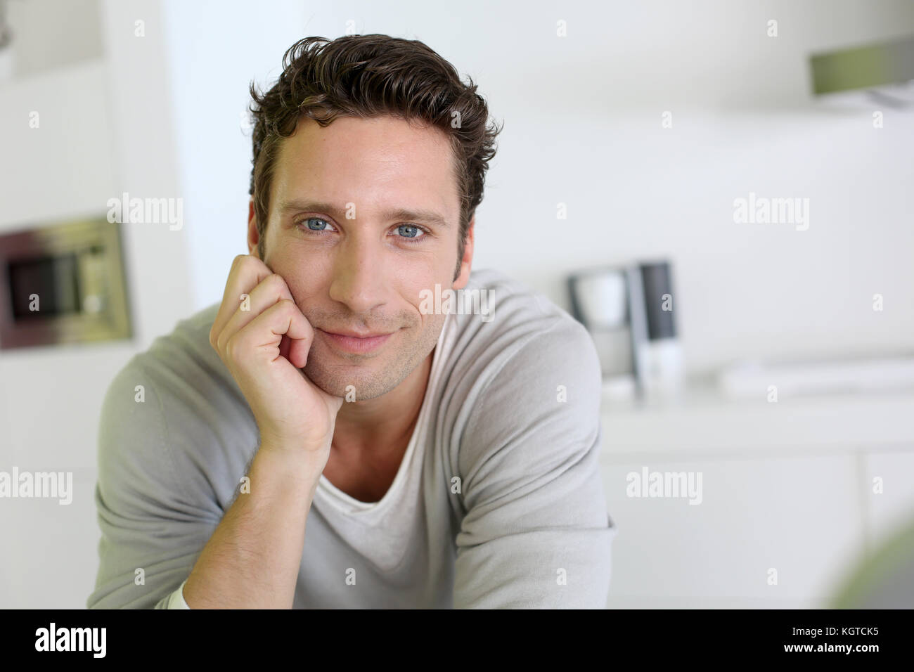 Portrait of handsome man looking at camera Stock Photo - Alamy