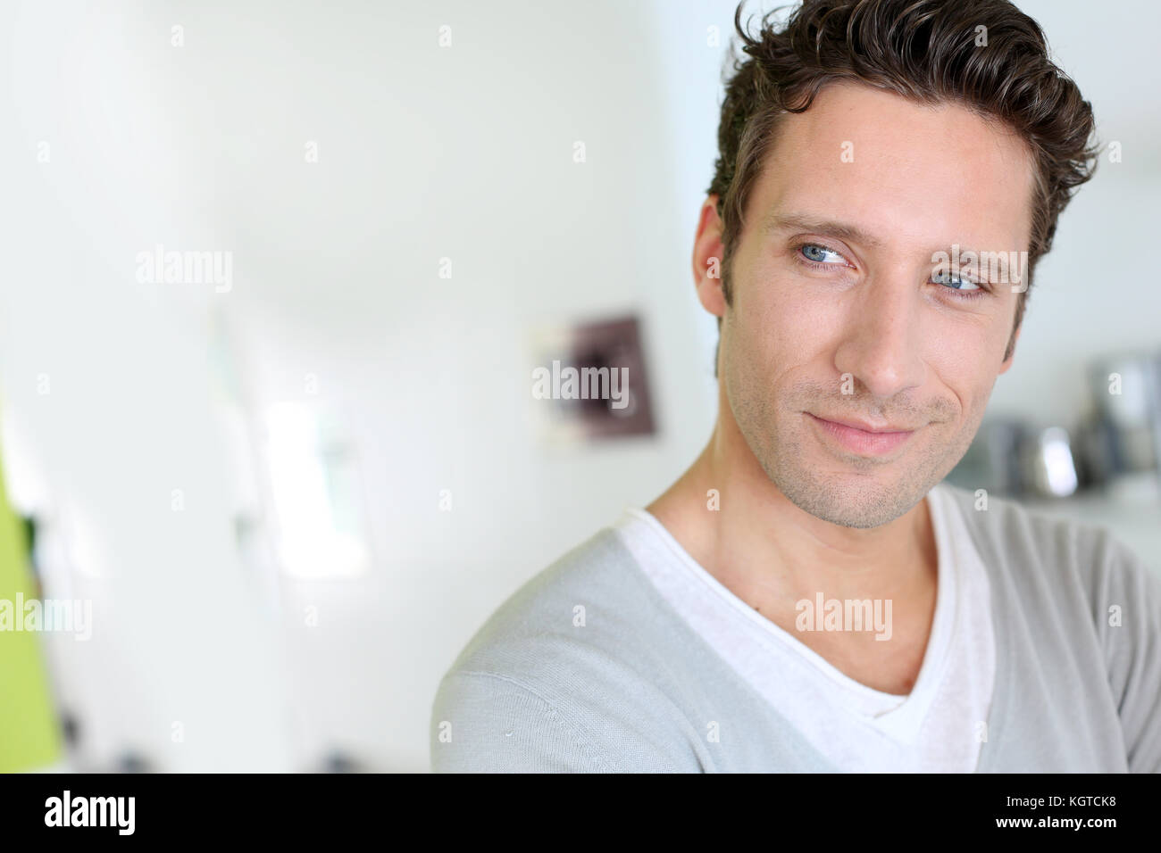 Portrait of handsome man looking at camera Stock Photo - Alamy