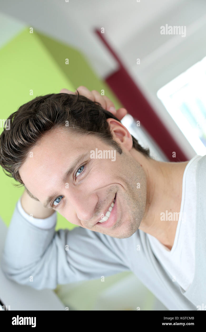 Portrait of handsome single man at home Stock Photo - Alamy